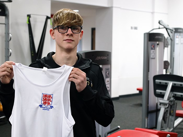 Boxing champ has the world in his hands